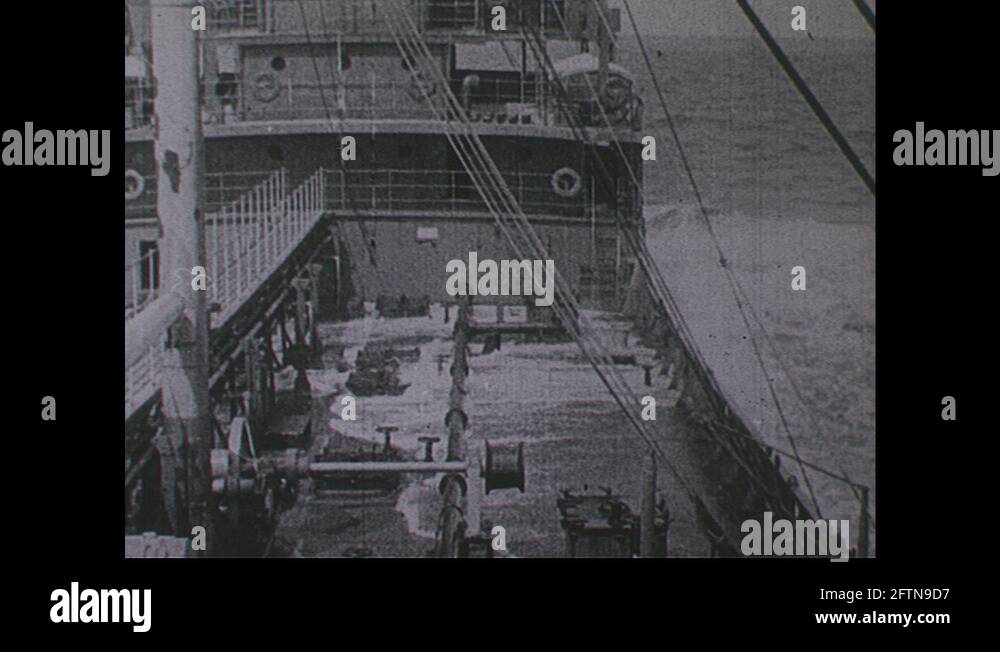 1940s: Waves crash on ship deck, fade out / Tank truck pulls up to gas ...