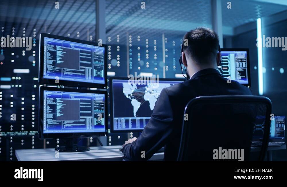 Back View of Technical Controller/ Operator Working at His Workstation ...