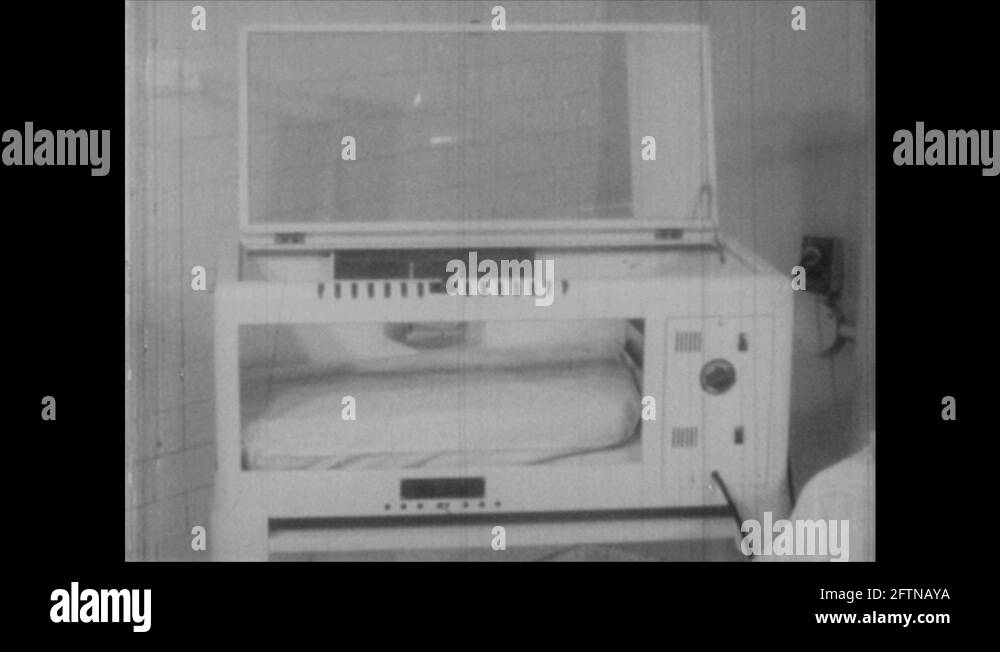 1940s: SCBU Cot for a Premature or Newborn Baby. Nurses Reassure Mother ...