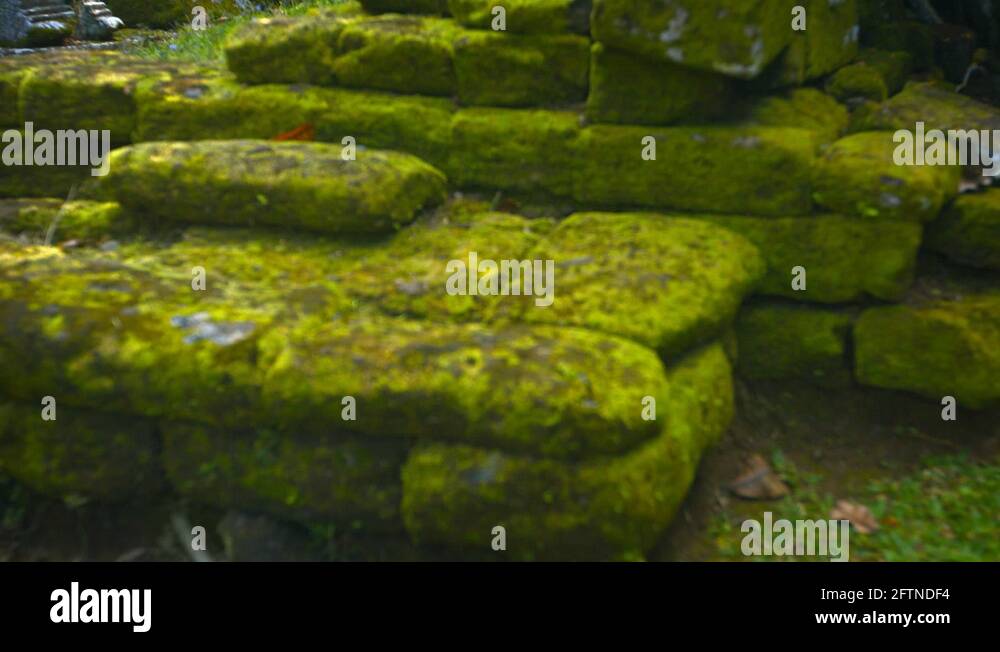 Mossy heap of stone rubble fromancient rock walls of temple ruins Stock ...