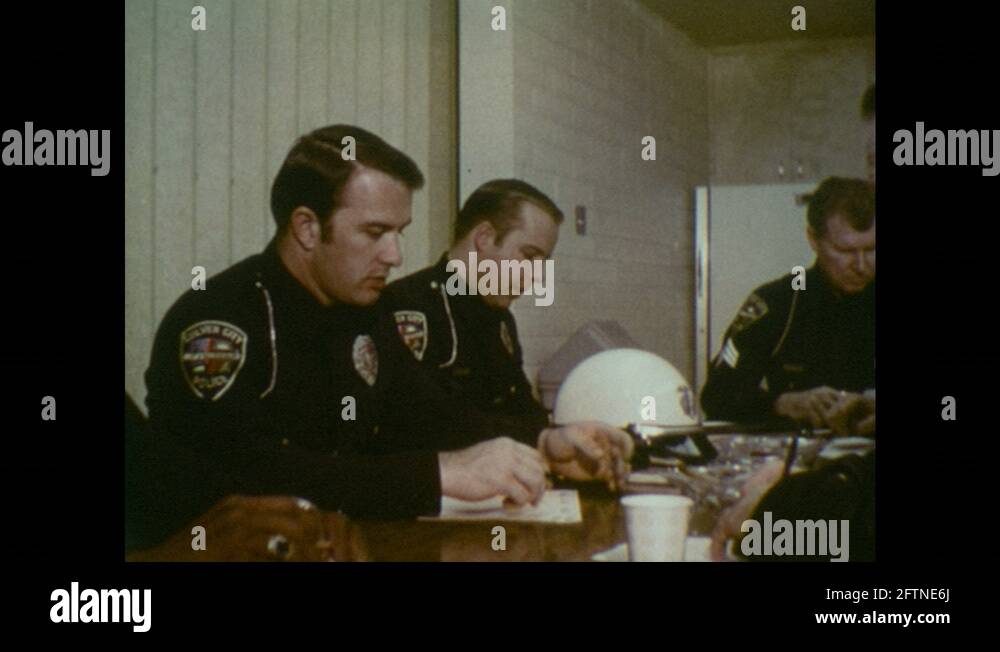 UNITED STATES 1970s: Police Officers Sit Around Table for Meeting Stock ...