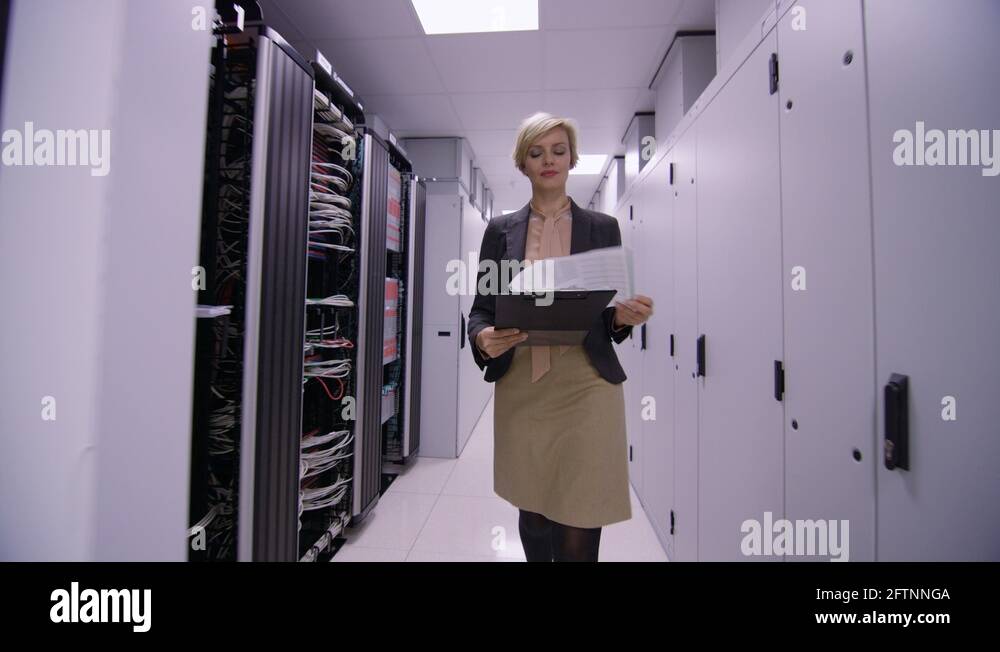 4K Group of computer technicians checking machines in a data center ...