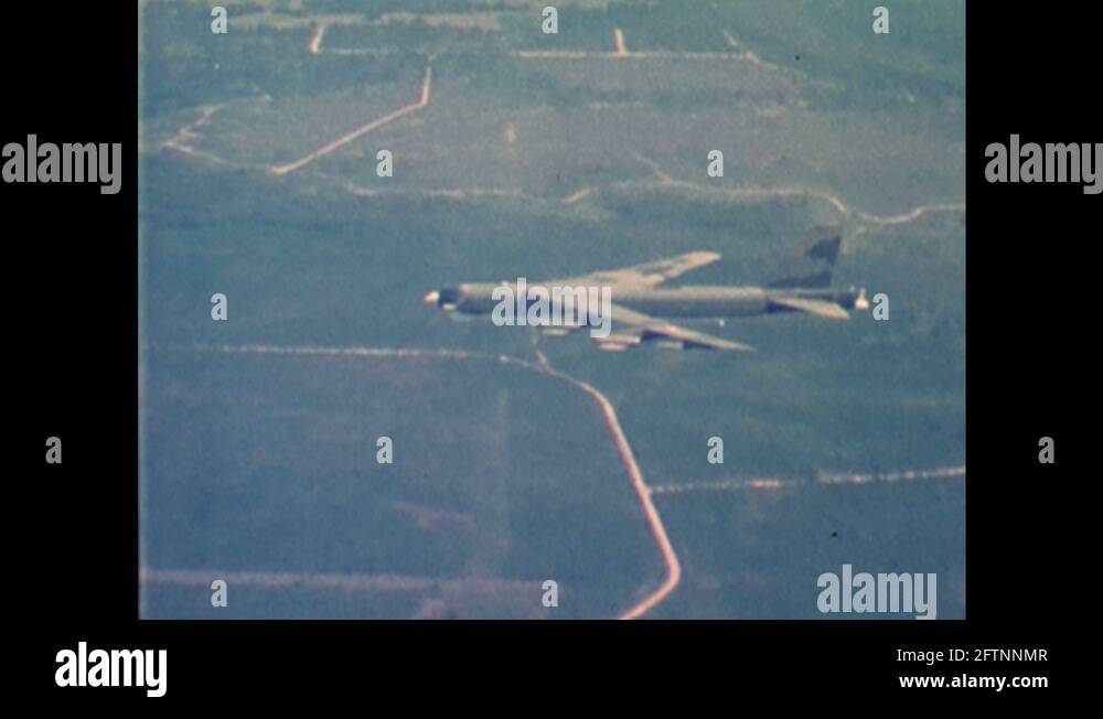 1970s: Side view of plane in sky. Internal view of plane cockpit during ...