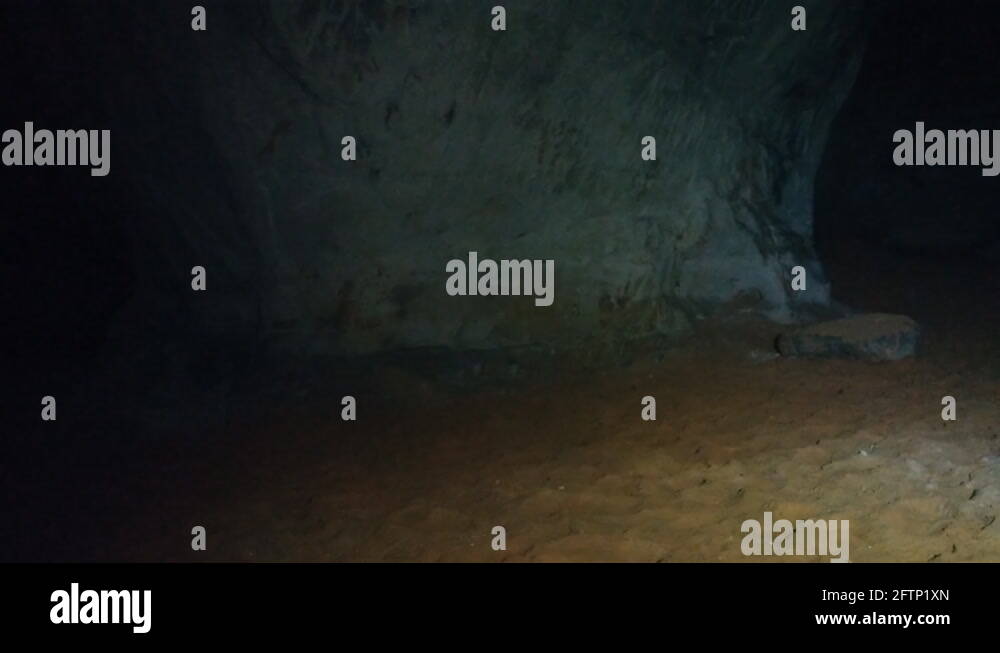 underground cave, inside faint light of lantern Stock Video Footage - Alamy