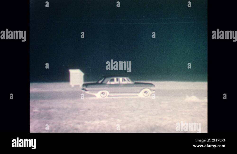 1965: Car drives in inverse color effect back into normal color Stock ...