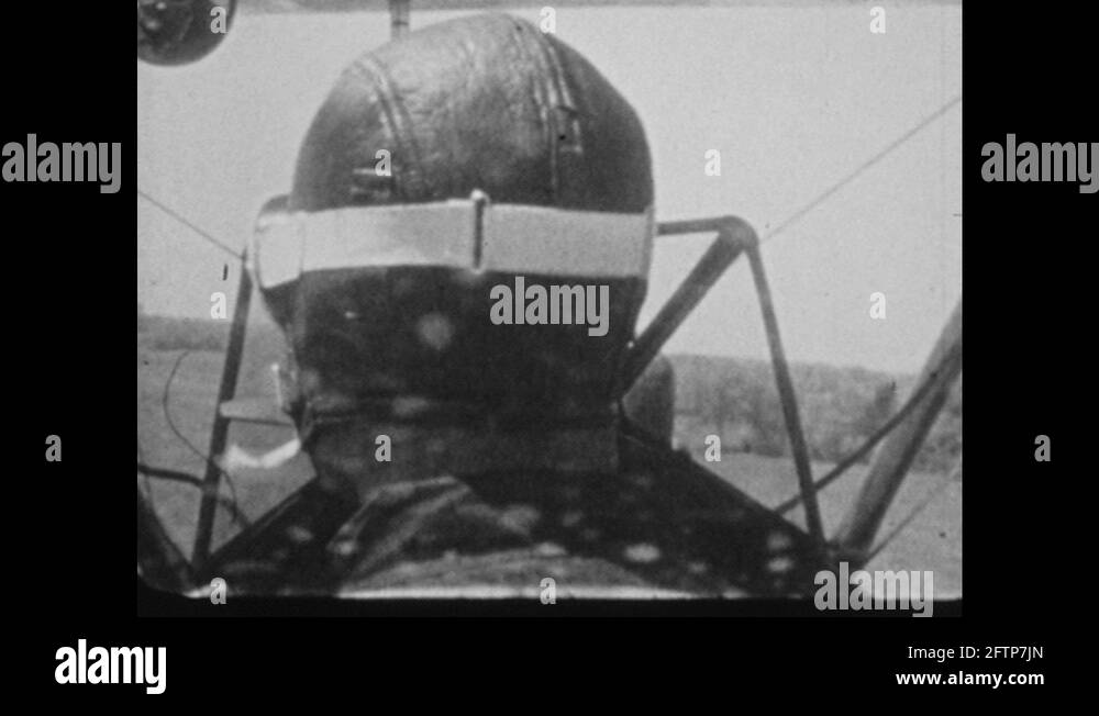 1960s: View of pilot from behind. Red Baron plane in flight. Early ...