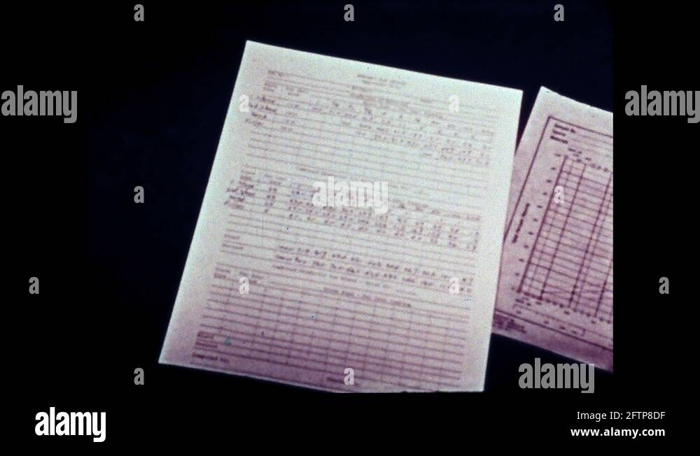 UNITED STATES: 1940s: Document on a desk. Paper showing a graph and ...