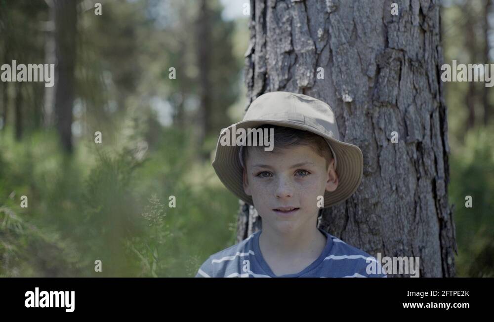Boy leaning against tree Stock Videos & Footage - HD and 4K Video Clips ...