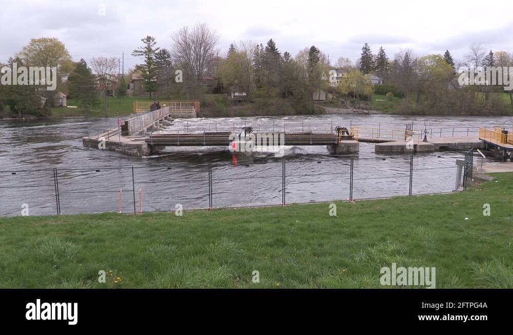 Crumbling dam and spillway infrastructure and fast flooding flood water ...