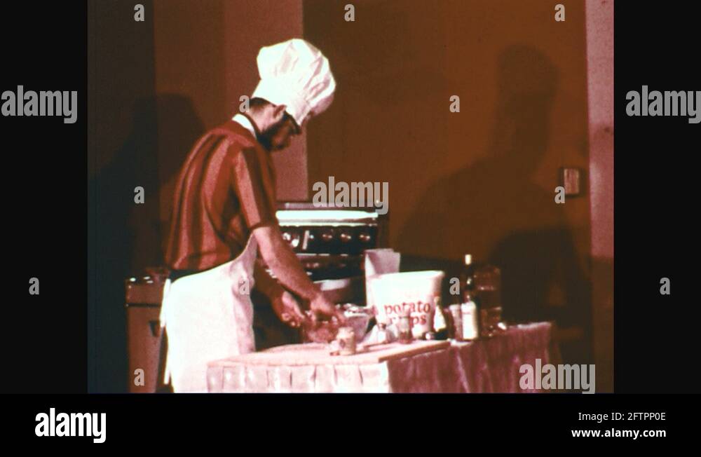 UNITED STATES: 1960s: chefs prepare food. Potato chips on counter Stock ...