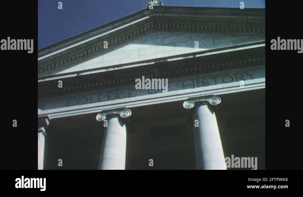 UNITED STATES: 1950s: columns at building entrance. Students leave ...