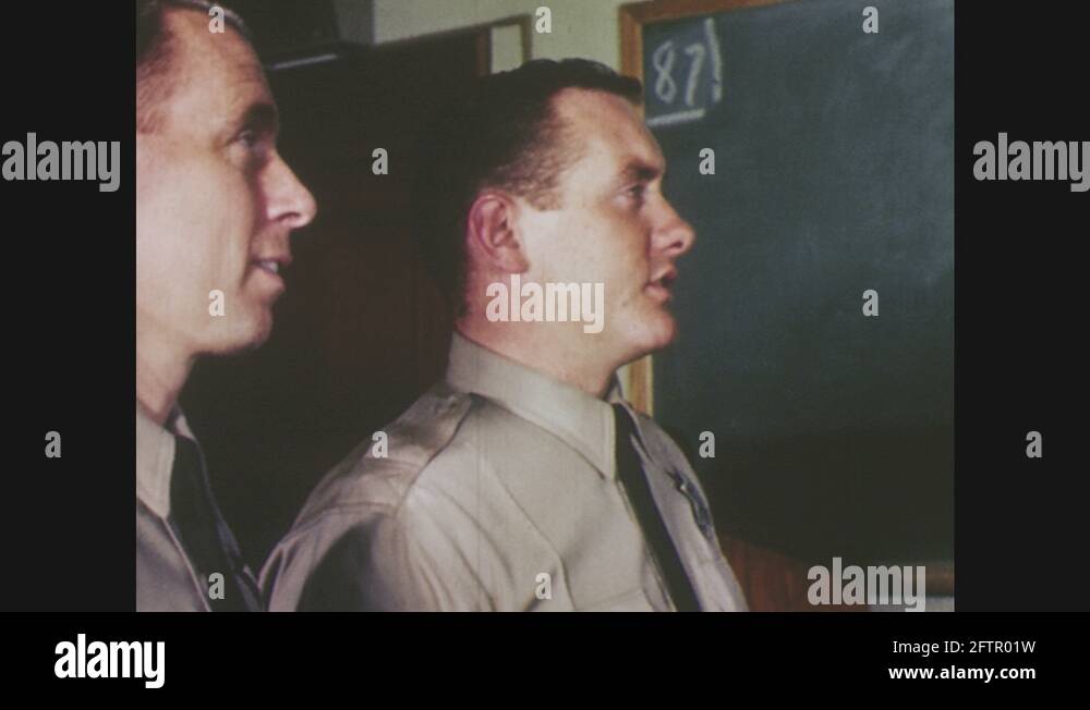 UNITED STATES: 1960s: police officers speak in classroom Stock Video ...