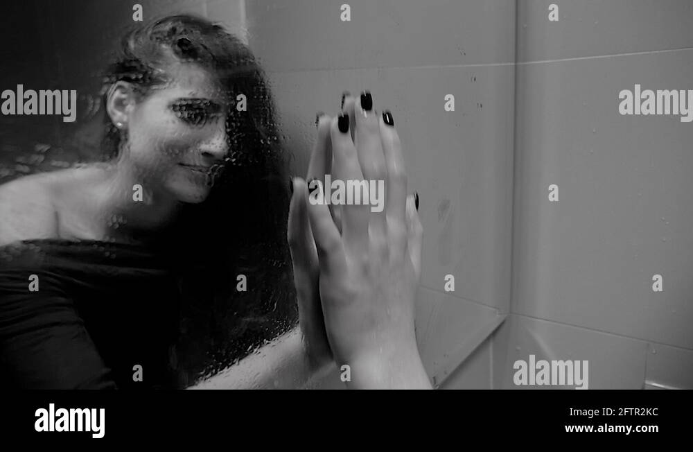 Sad woman crying touching mirror slow motion black and white Stock ...
