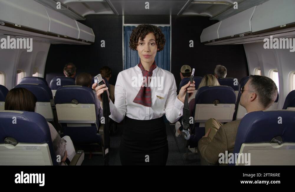 Airliner flight attendant explaining saftey rules Stock Video Footage ...