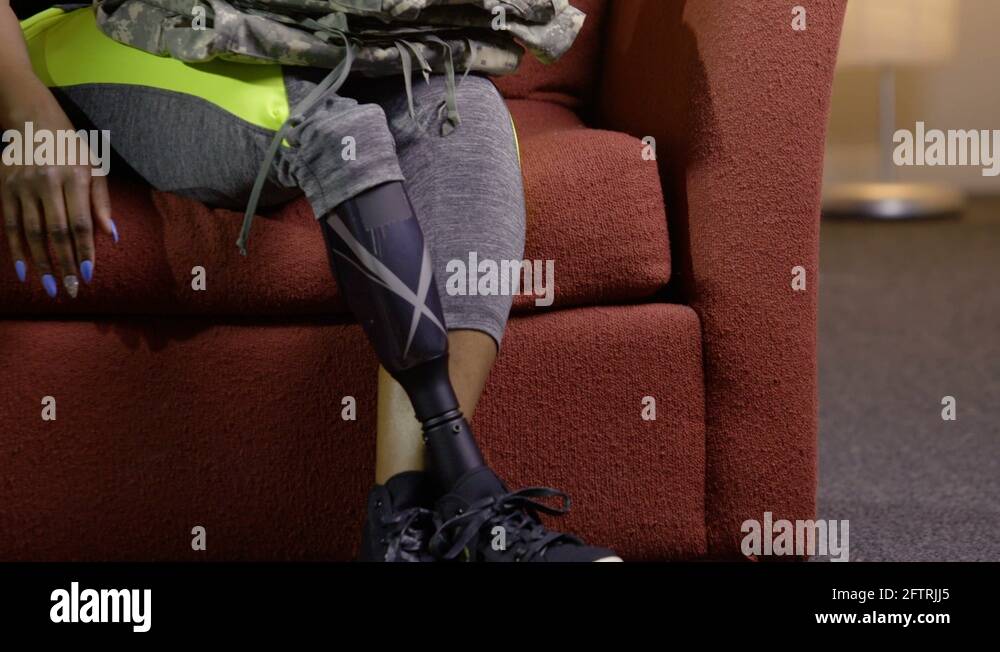 Black female amputee holding her fatigues and smiling Stock Video ...