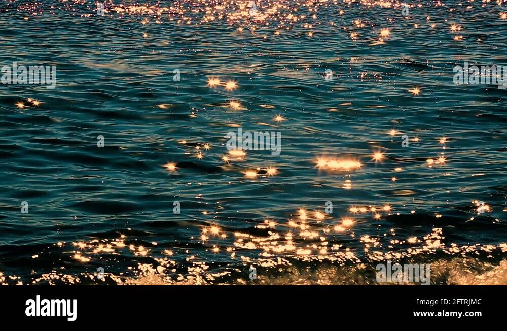 Beautiful blue water background with sun sparkles on surface Stock ...