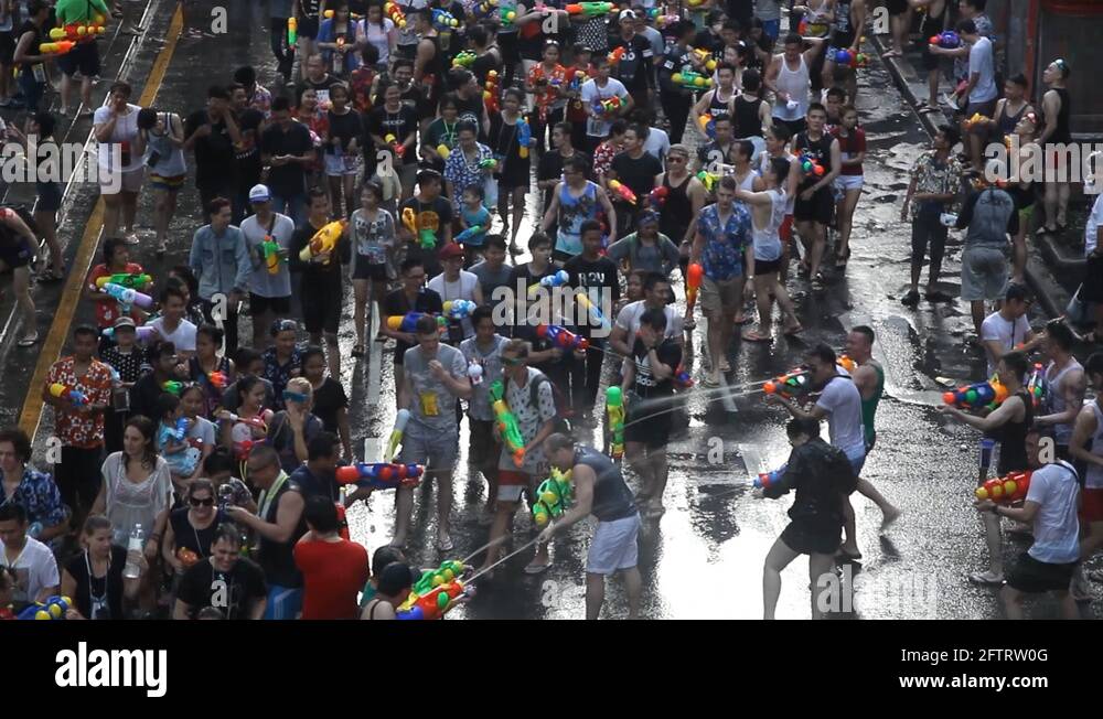People splash each other with water to celebrate Songkran new year in ...