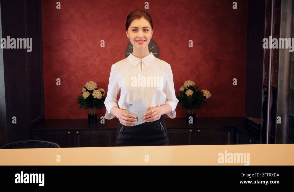 Receptionist at hotel reception desk meet guests. 4K Stock Video ...