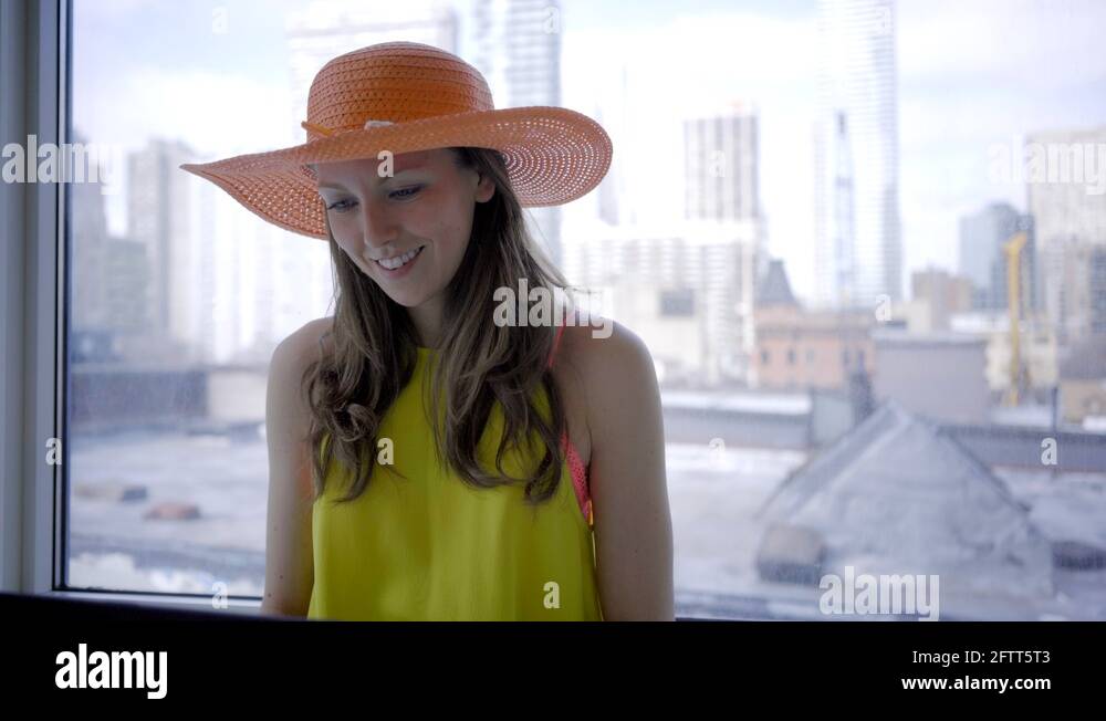 Woman in her 30s inside a modern condominium in downtown toronto ...