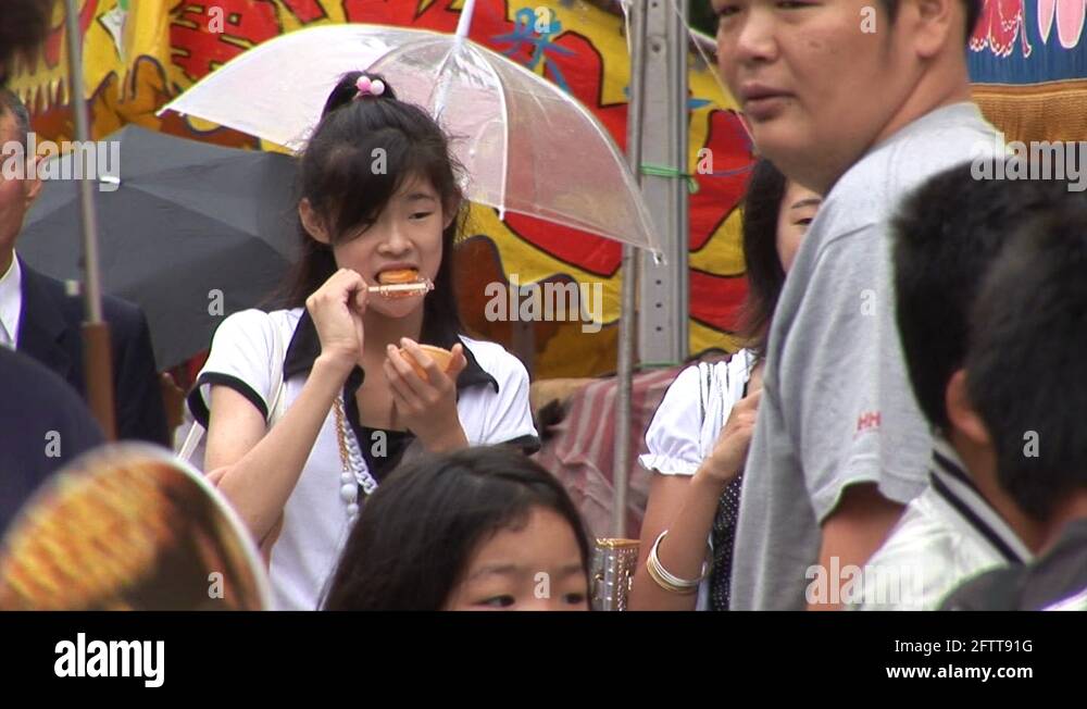 Japaneses Walking and Eating at Street Market in Yasukuni Shrine, Tokyo ...