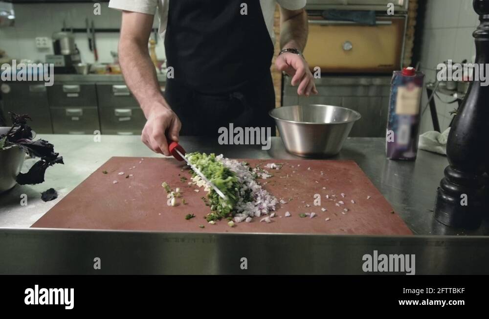 chef cooking food on kitchen, man male knife preparation green in ...