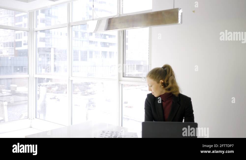 Woman in her 30s inside a modern condominium in downtown toronto ...
