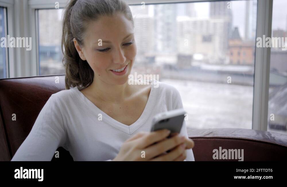 Woman in her 30s inside a modern condominium in downtown toronto ...