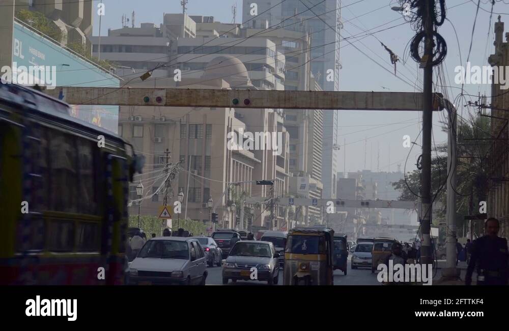 Traffic goes by in the busy district of Karachi, Pakistan Stock Video ...