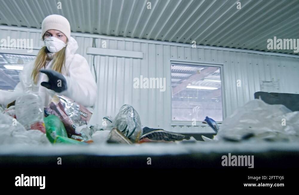 Woman Separating Plastic Waste at Recycling Facility Stock Video ...