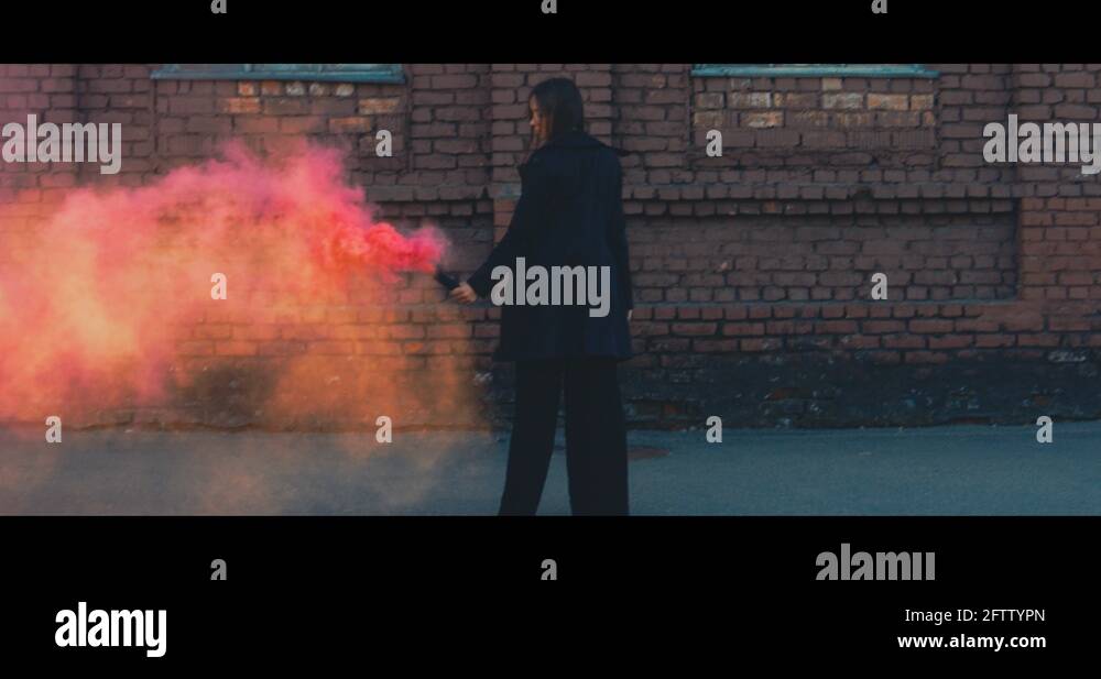 CINEMAGRAPH - seamless loop. Caucasian girl standing with a red color ...