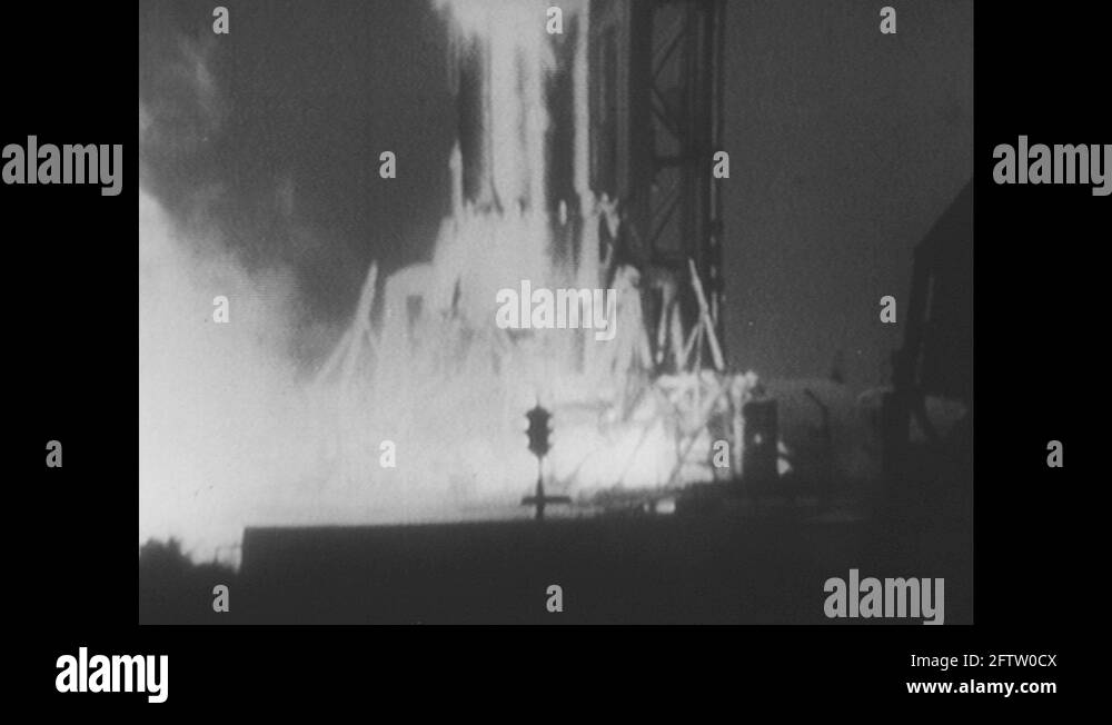 UNITED STATES: 1960s: rocket launches from Earth. Smoke around base of ...