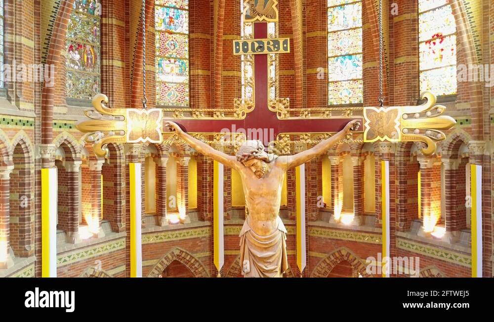 Flying backwards from hanging Jesus cross and altar in a catholic ...