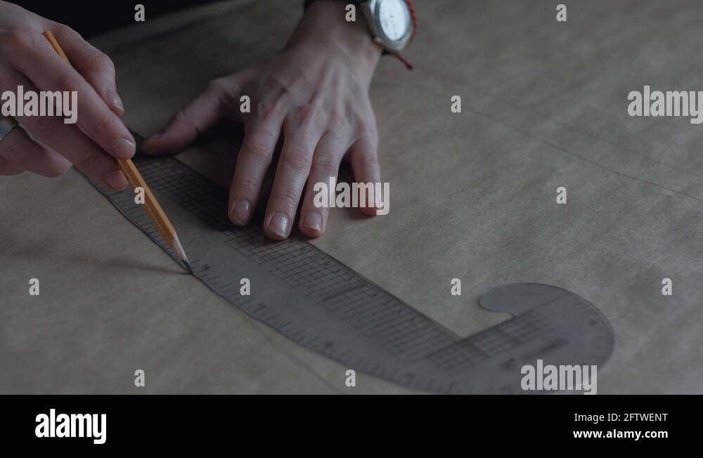 Close-Up: Fashion Designer Creates the Layout of the Dresses Stock ...