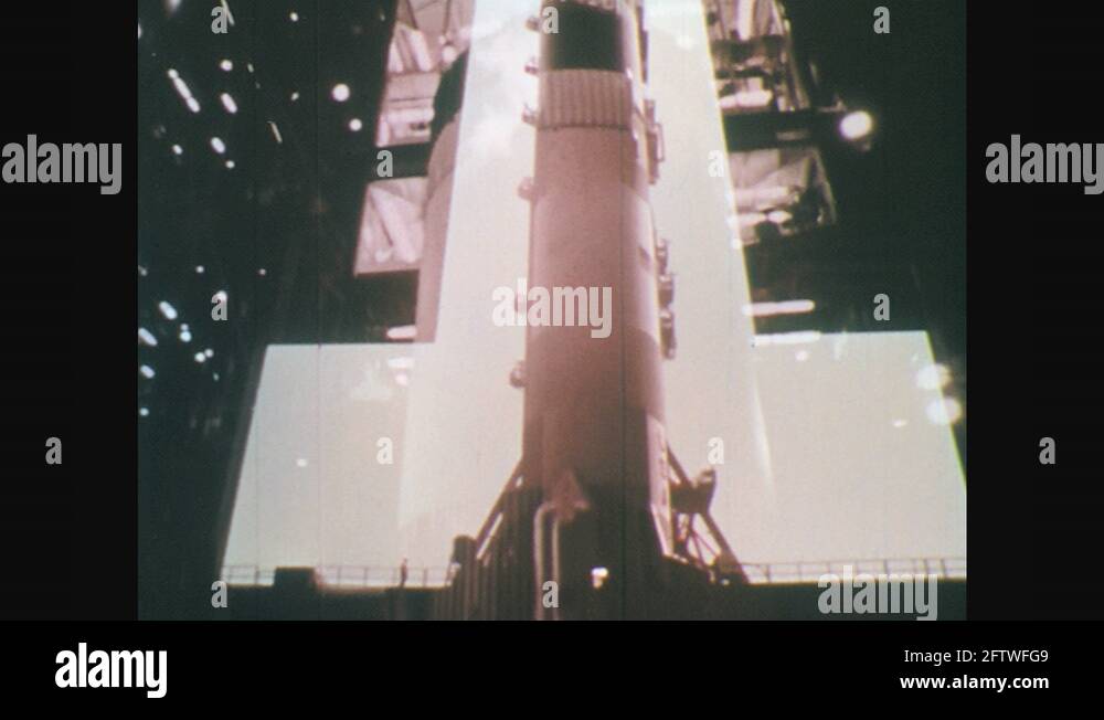 1960s: UNITED STATES: space rocket inside hanger. Rocket on scaffold ...