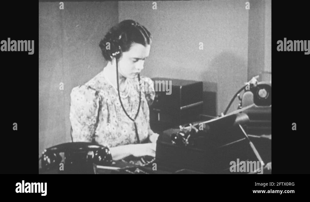 1940s: UNITED STATES: lady types on typewriter. Typewriter jams. Lady ...