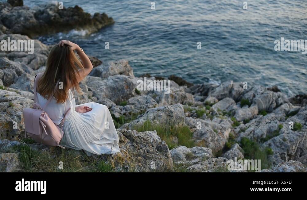 Young girl sitting on rocks Stock Videos & Footage - HD and 4K Video ...