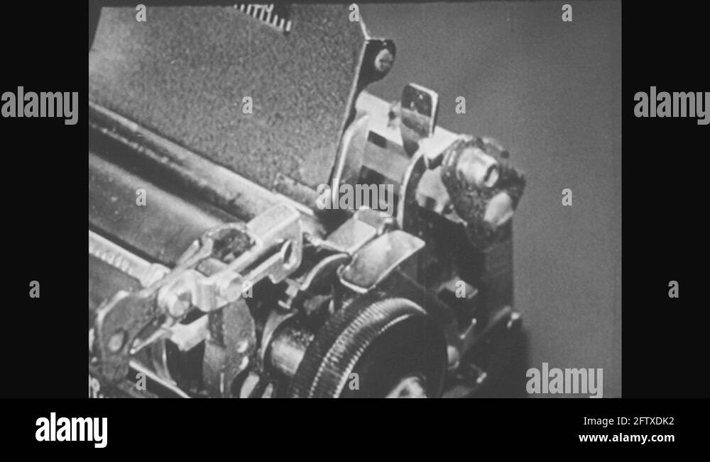 1940s: UNITED STATES: close up profile of typewriter buttons. Hand ...