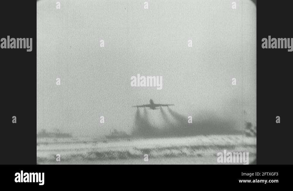 1960s: jet airplane lifts off from runway with four contrails and flies ...