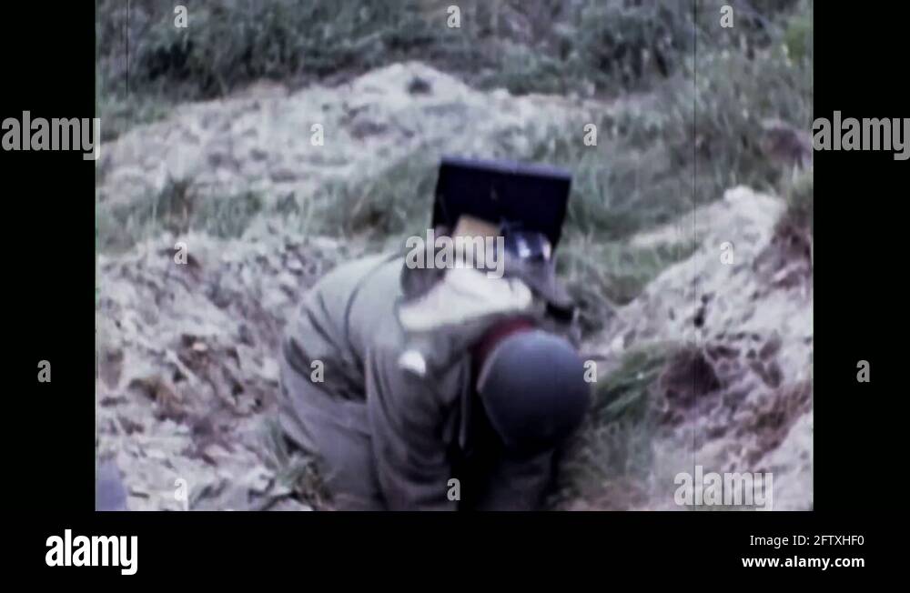 1944 – Soldiers digging foxholes on utah beach after landing operation ...