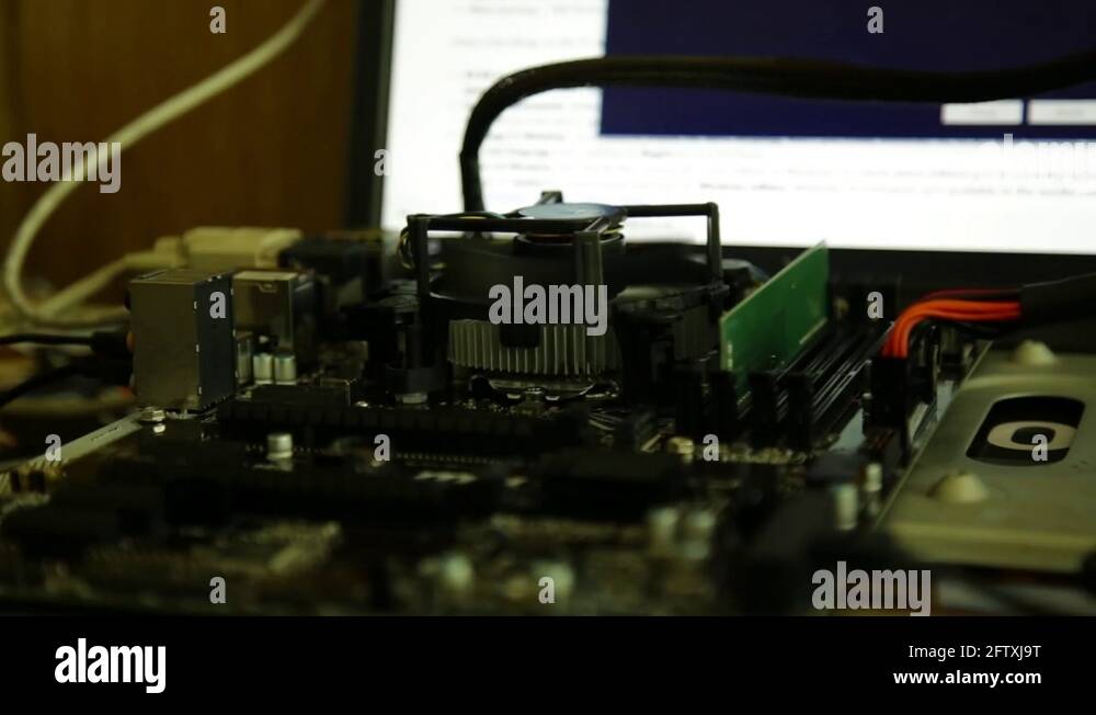 computer motherboard - processor fan and network card on a monitor ...