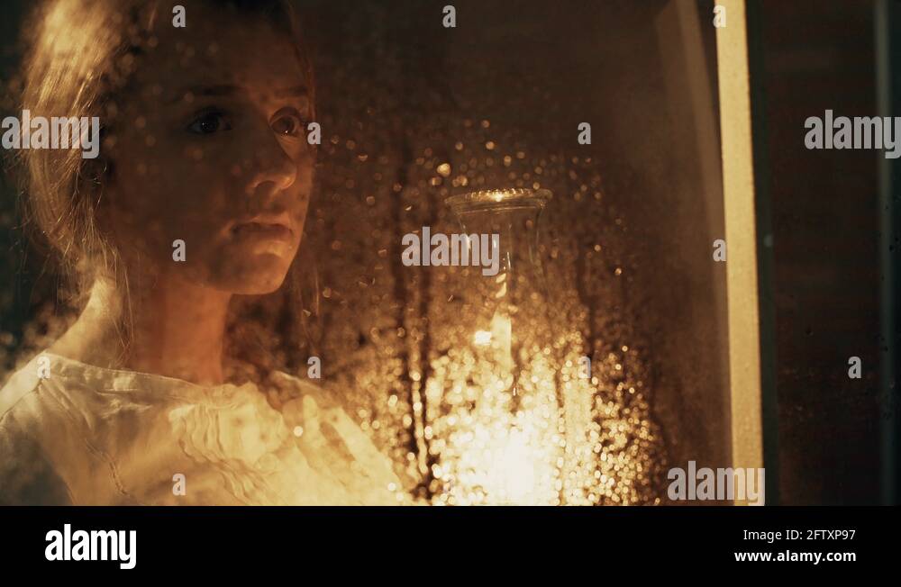 Woman looking out the window and rain Stock Videos & Footage - HD and ...