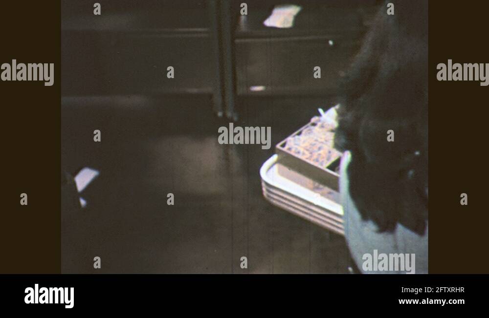 1960s: UNITED STATES: lady types numbers into machine. Lady sorts ...