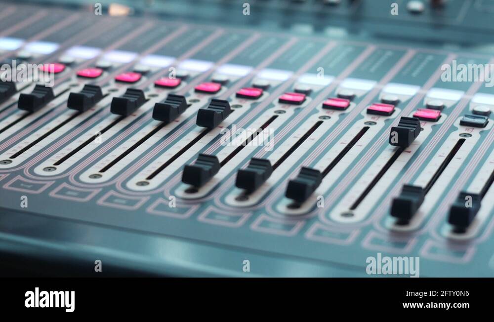 studio console with lots of buttons and displays in the hardware block ...