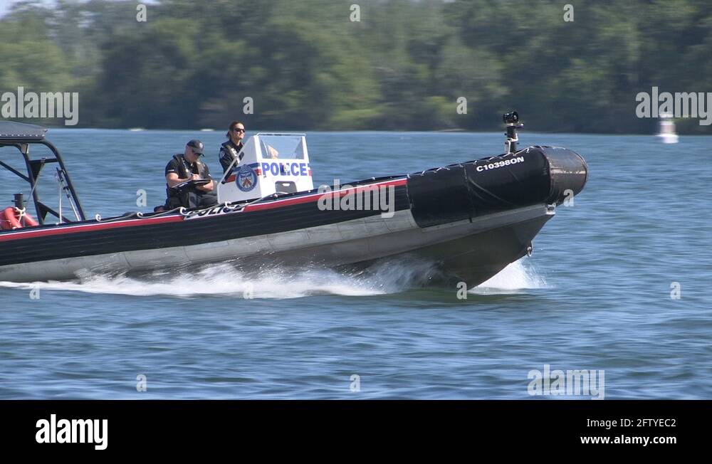 Police officers on marine unit patrol boat in Toronto harbor Stock ...