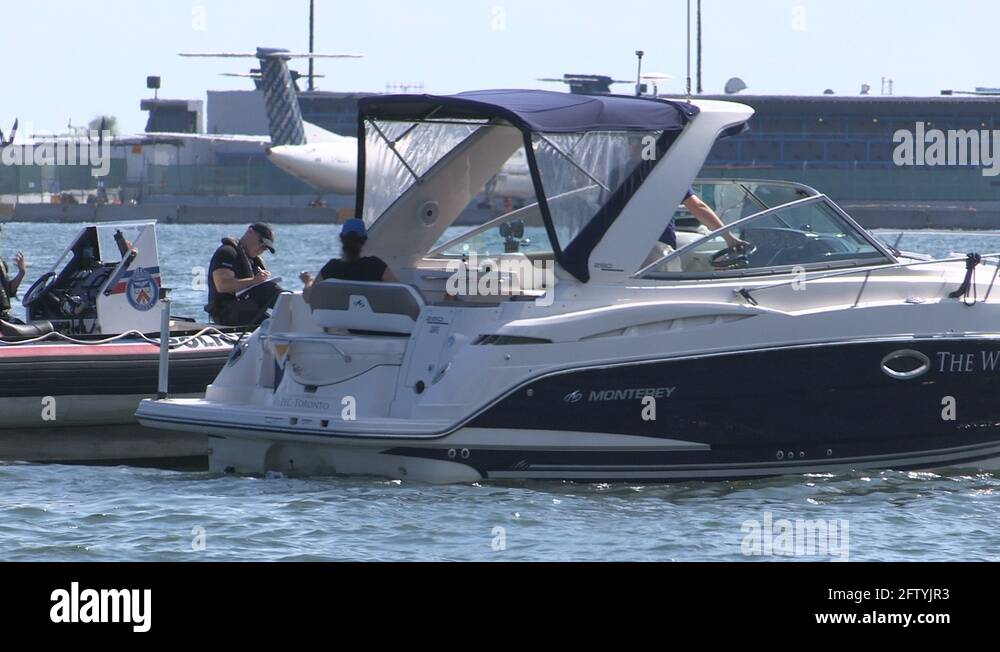 Police officers on marine unit patrol boat in Toronto harbor Stock ...