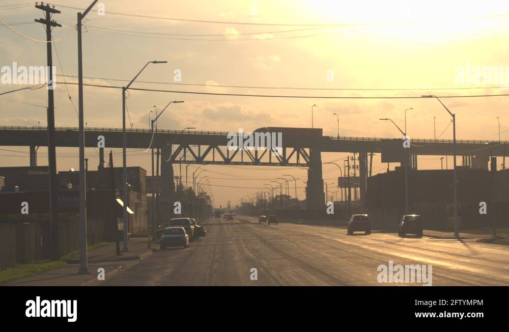 CLOSE UP Traffic on busy highway through Detroit industrial zone at ...