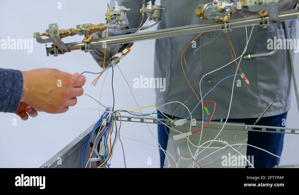 Two people are trying to resolve the problem with the wires Stock Video ...
