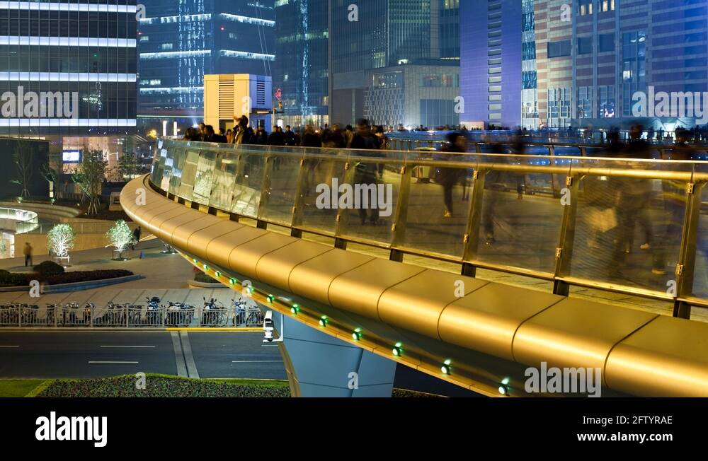 Circular pedestrian walkway with Flags flying above a traffic ...