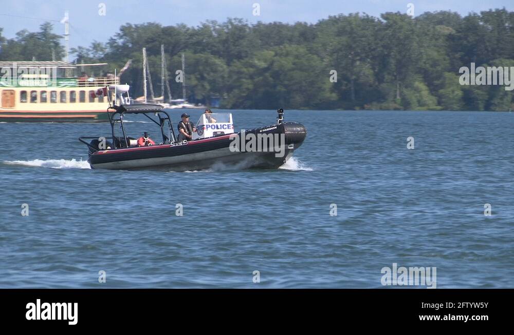 Police officers on marine unit patrol boat in Toronto harbor Stock ...