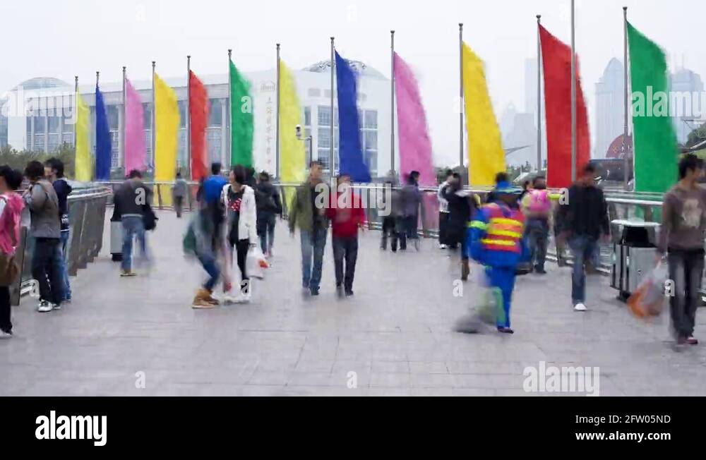 Circular pedestrian walkway with Flags flying above a traffic ...